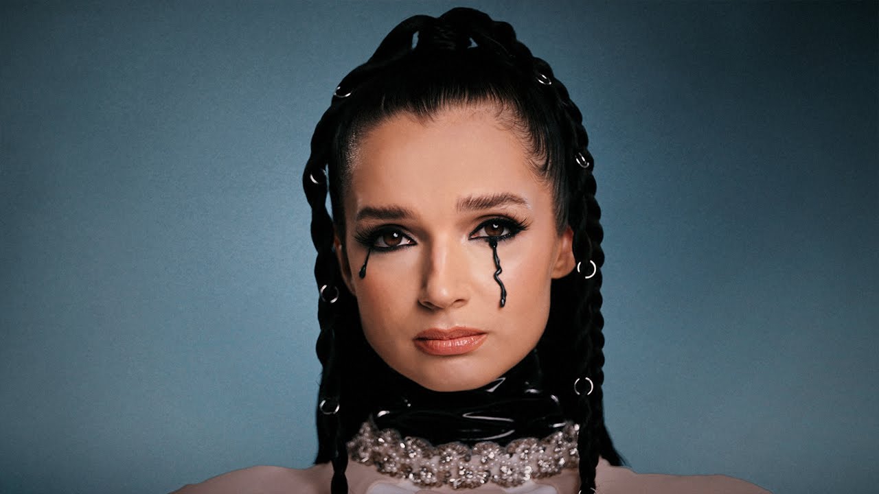 Hear POPPY deliver metal and synth-pop on contrasting new songs